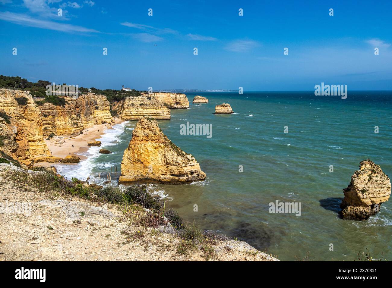 Praia da Marinha Beach among rock islets and cliffs seen from Seven ...