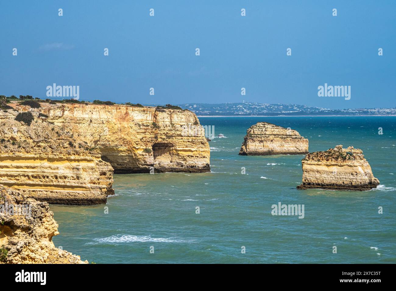 Praia da Marinha Beach among rock islets and cliffs seen from Seven ...