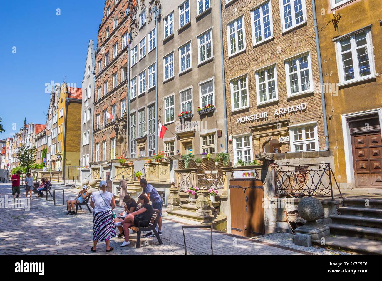 People in the historic Swietego Ducha street of Gdansk, Poland Stock ...