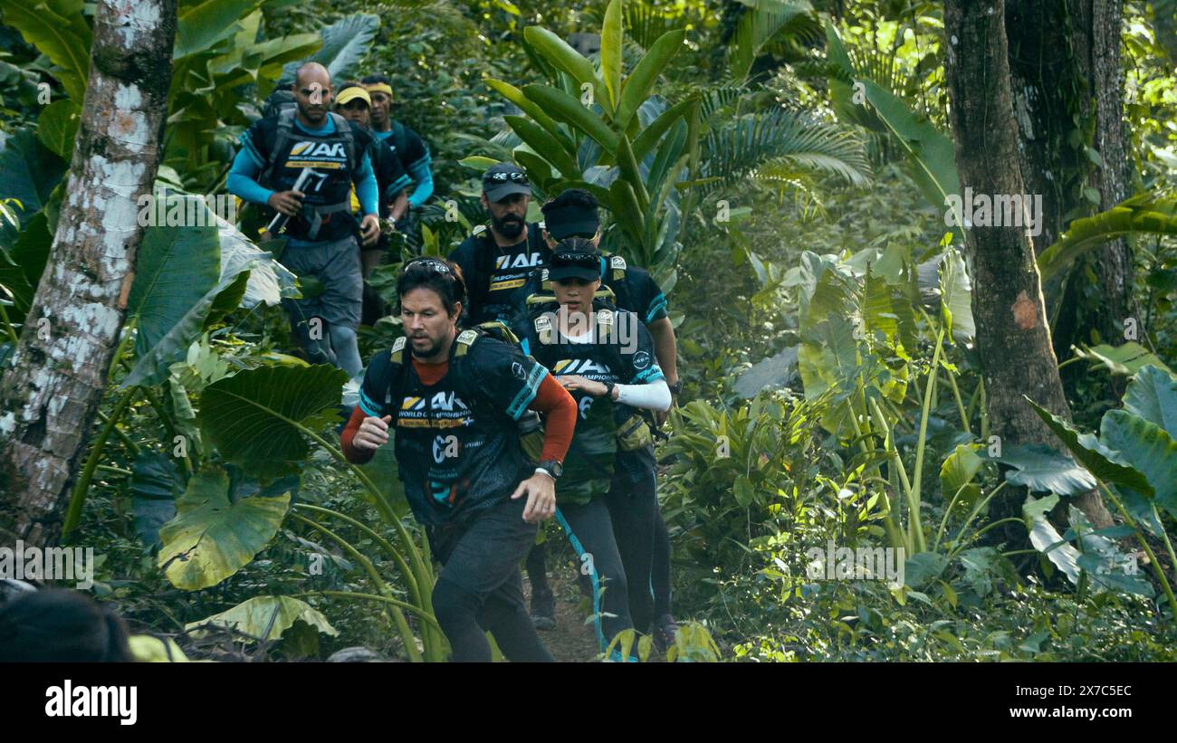 MARK WAHLBERG and NATHALIE EMMANUEL in ARTHUR THE KING (2024), directed ...