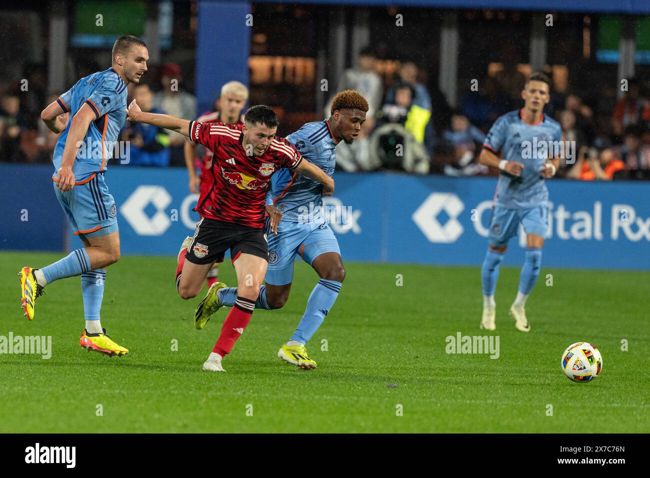 New York, USA. 18th May, 2024. Lewis Morgan (9) of Red Bulls and Tayvon ...