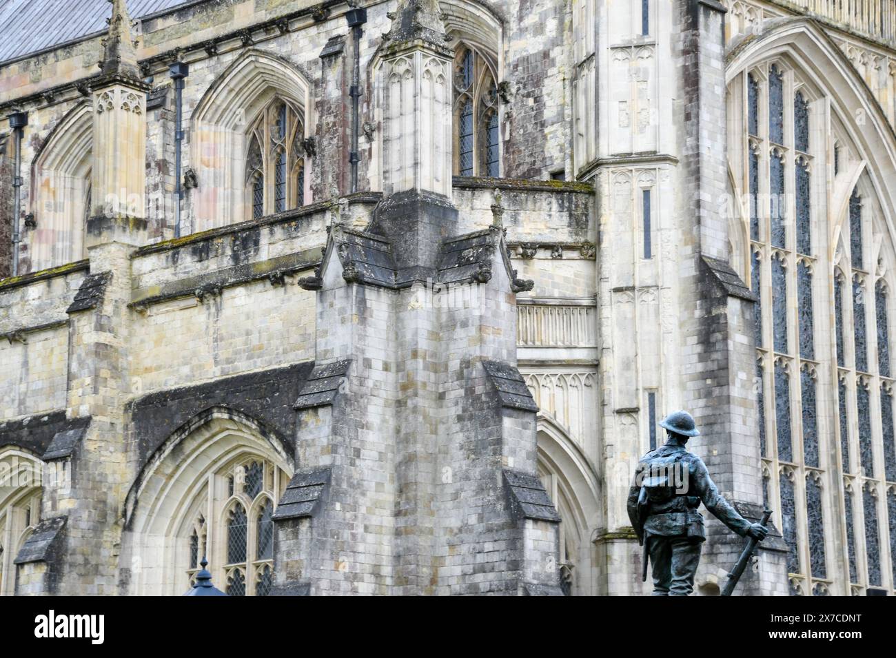 Bronze Statue of a WW1 British soldier stands looking in reverence ...