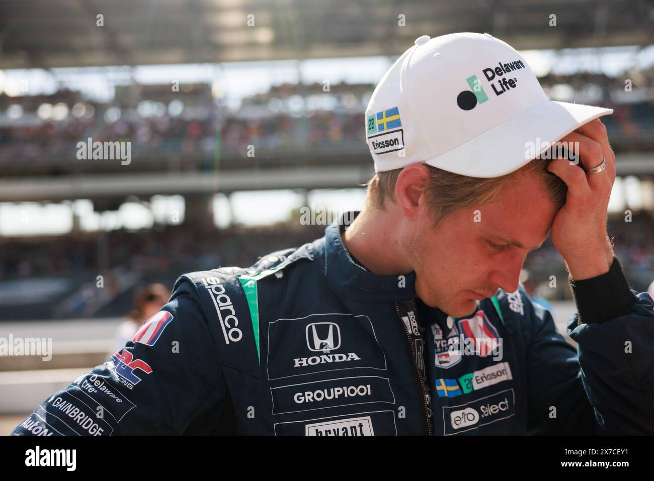 Indy car driver Marcus Ericsson (28) talks to a teammate after trying ...
