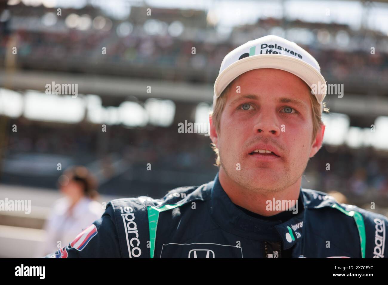 Indy car driver Marcus Ericsson (28) talks to a teammate after trying ...