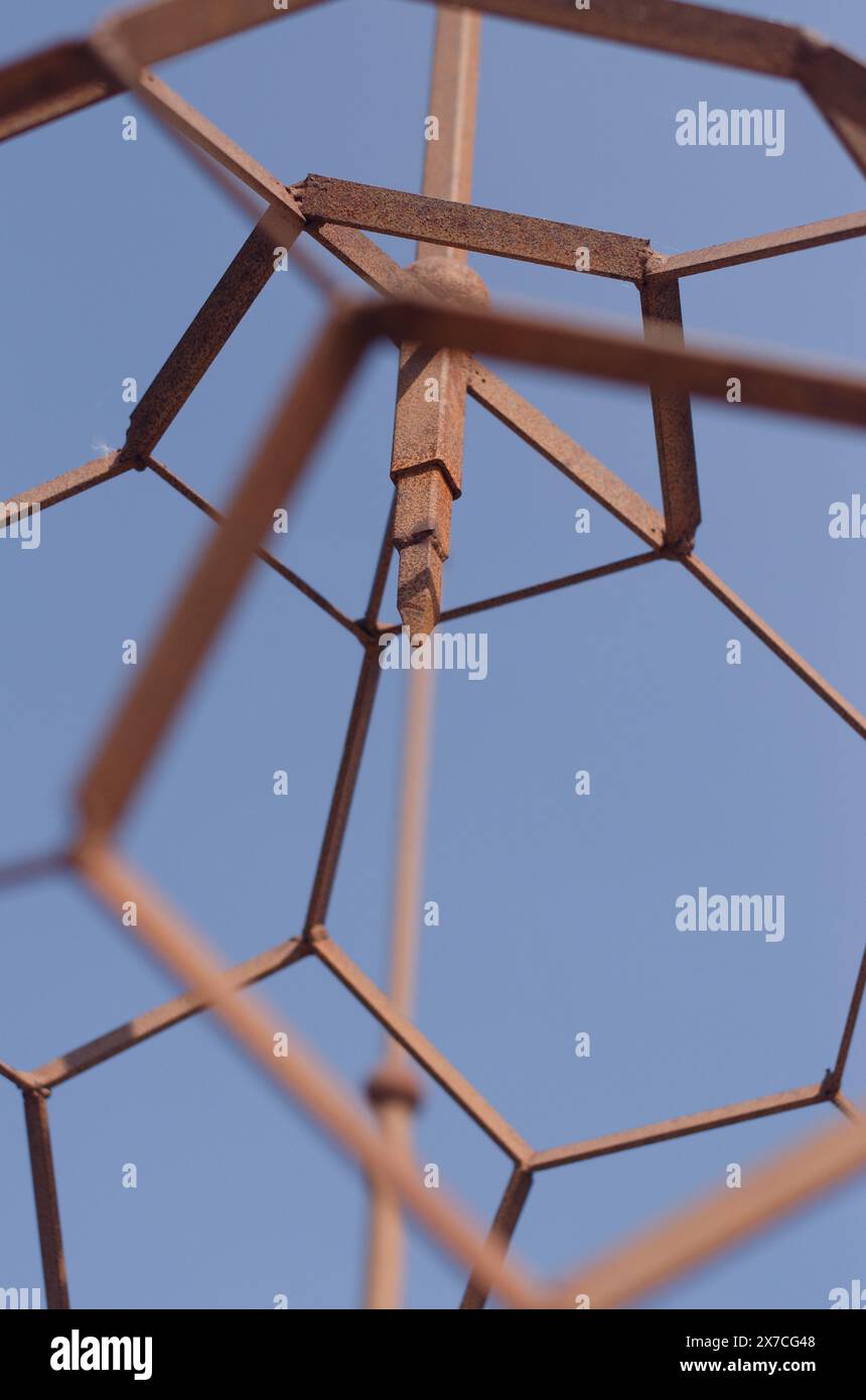 Abstract geometric shape made from metal rods. Line deformation. High ...