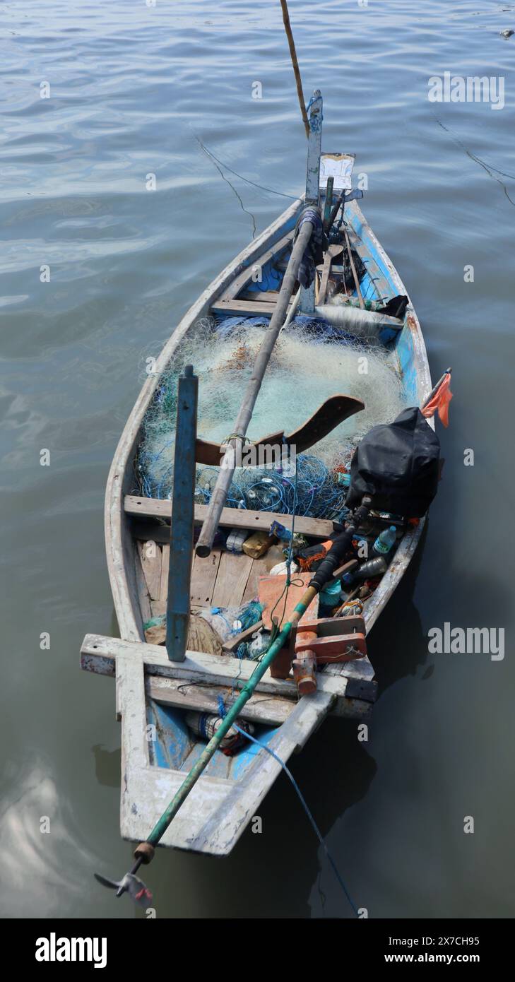 wooden fishing boat with net leaning on the beach in the morning Stock ...