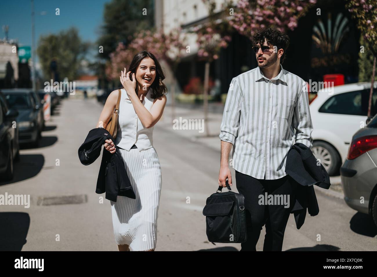 Cross generational business colleagues discussing work in an urban city ...