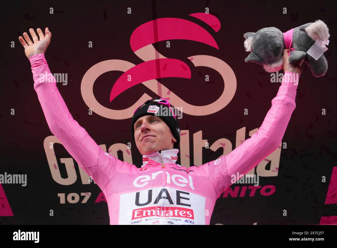 Tadej Pogacar celebrates on podium after winning the 15th stage of the ...