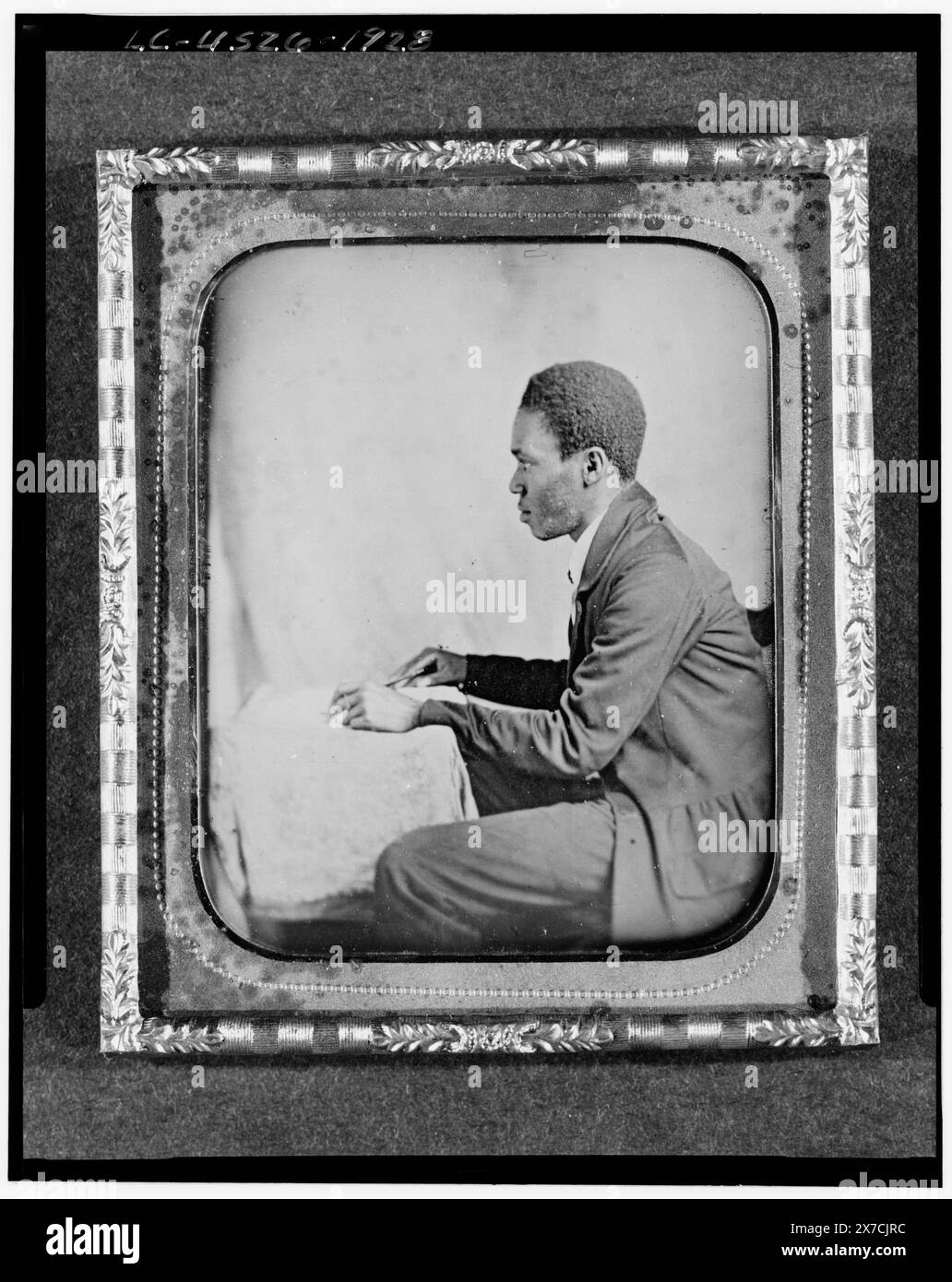 C.H. Hicks, in profile, seated at desk, Photograph attributed to ...