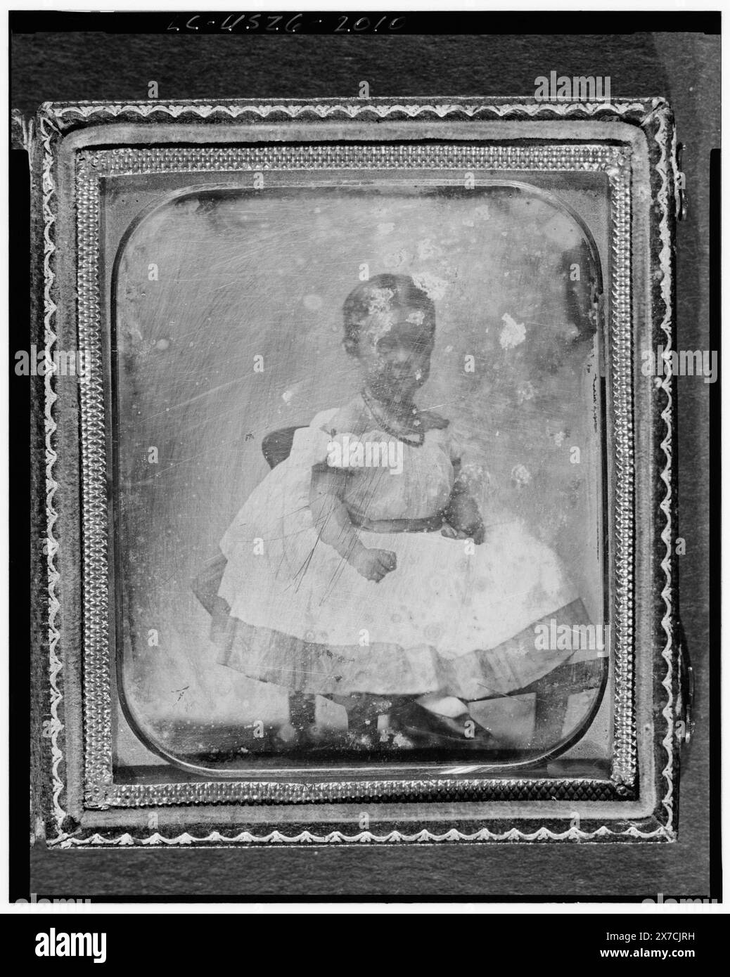 Mabel Hubbard as a girl, full-length portrait, seated on chair ...