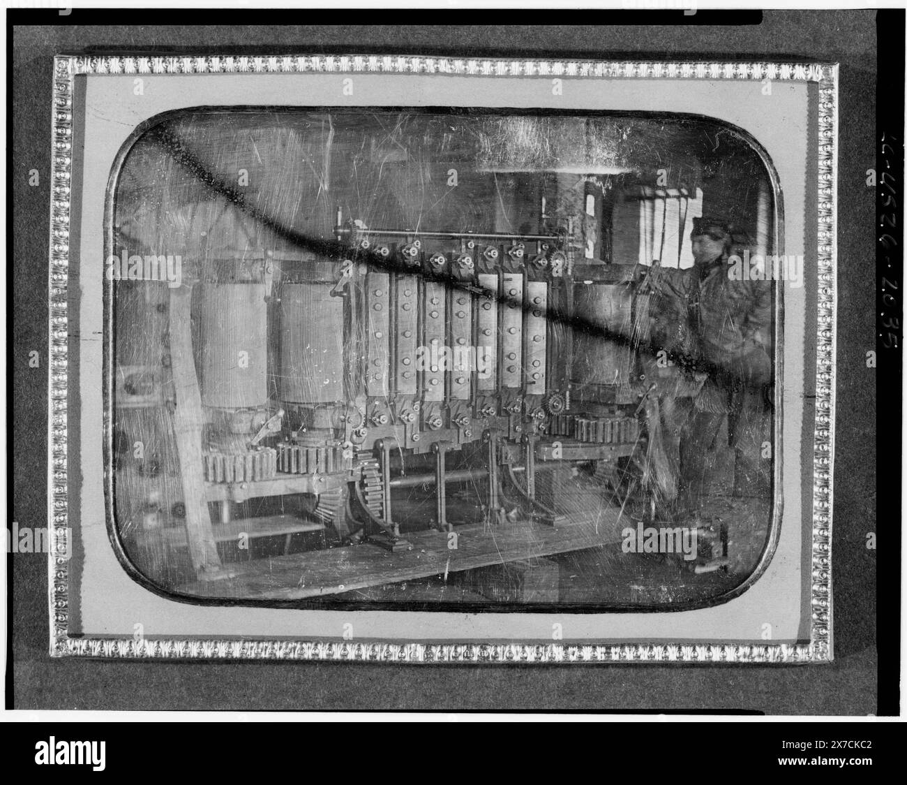 Occupational portrait of an unidentified man with an engine ...