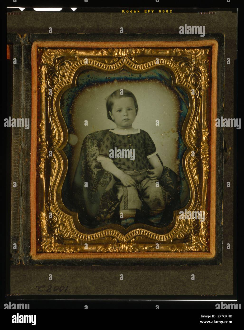 Unidentified boy, three-quarter length portrait, seated in chair ...