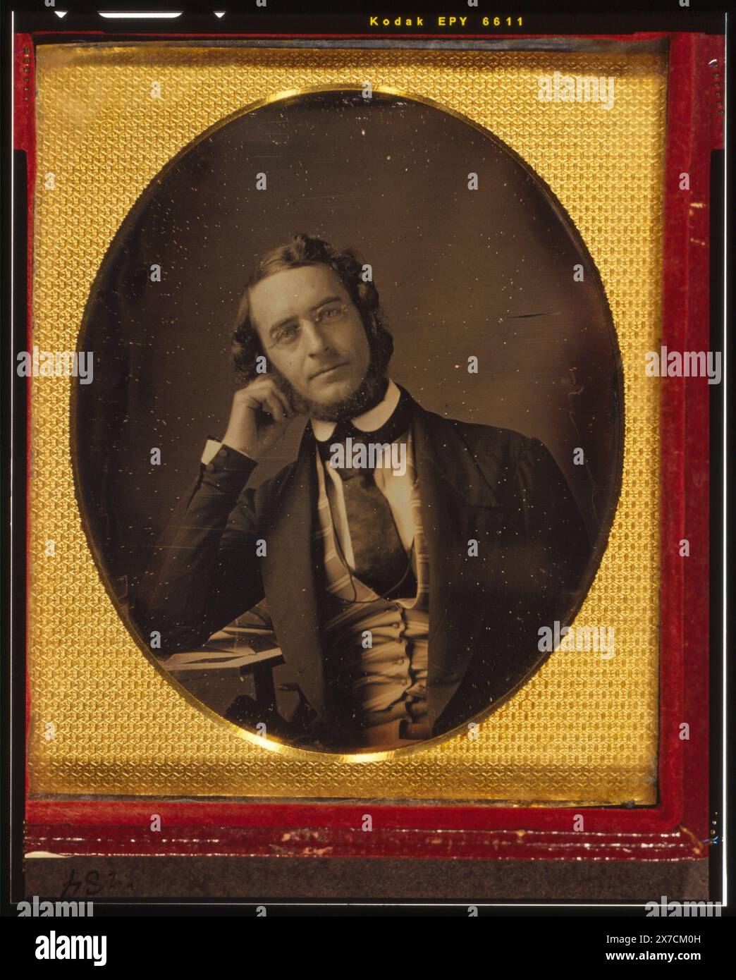 James Curtis Booth, half-length portrait, seated with arm resting on ...