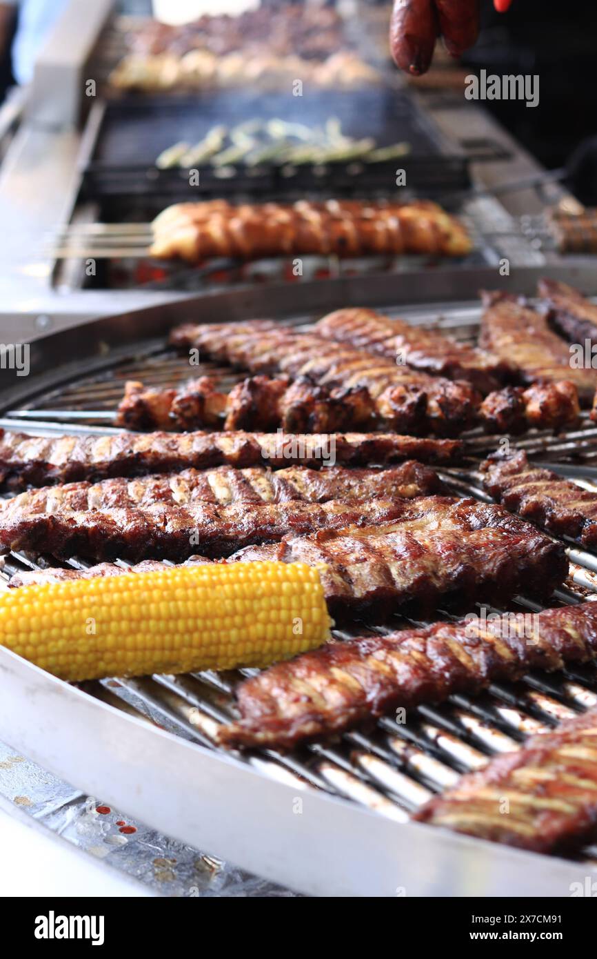 Electric grill in the food court at the fair. Large round rotating ...