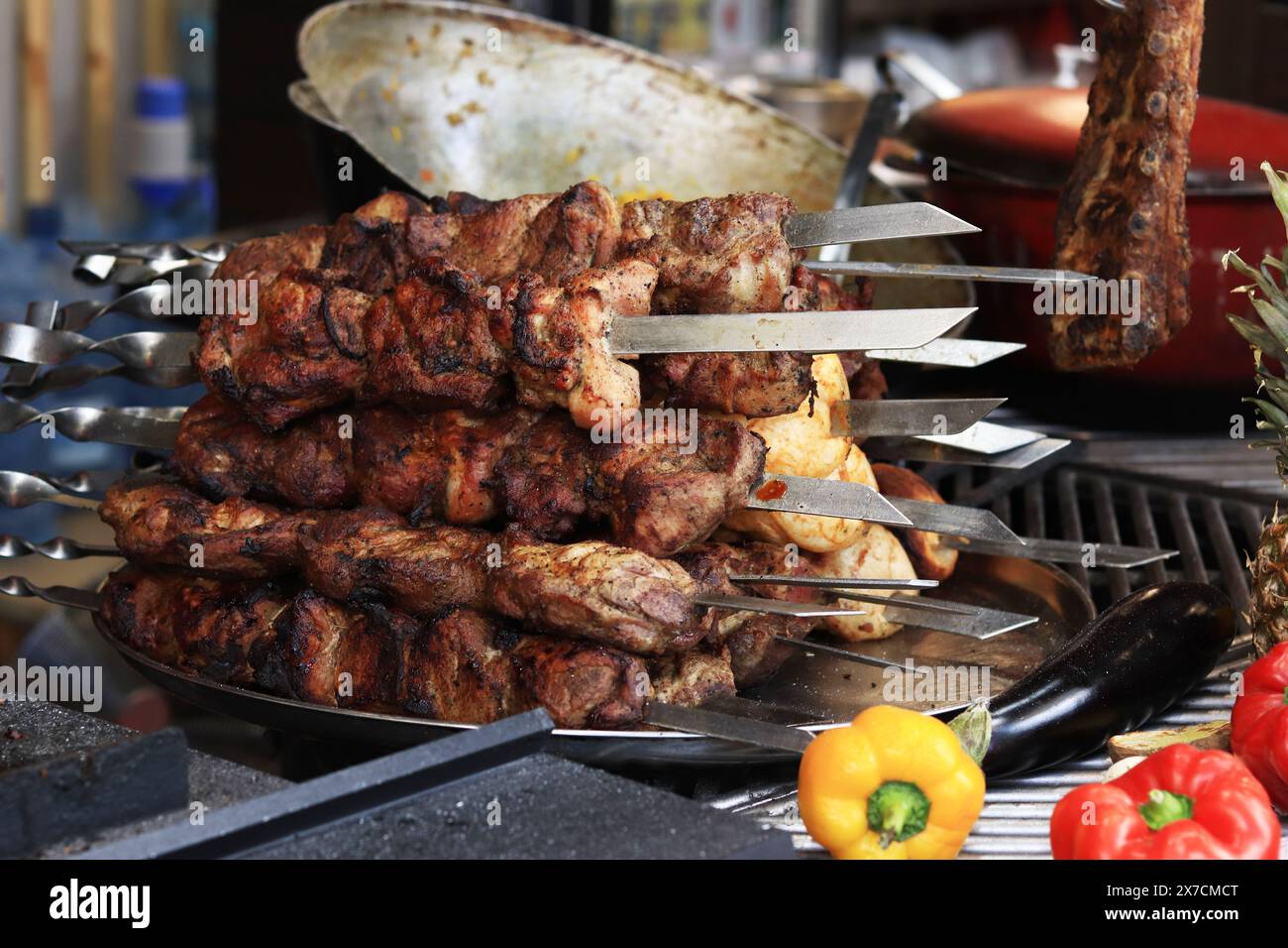Kebabs on skewers, close-up. Food court at the fair, outdoor cooking ...