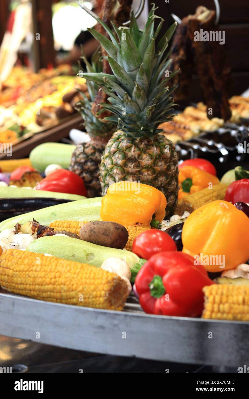Street food at the fair, food court decorated with vegetables ...
