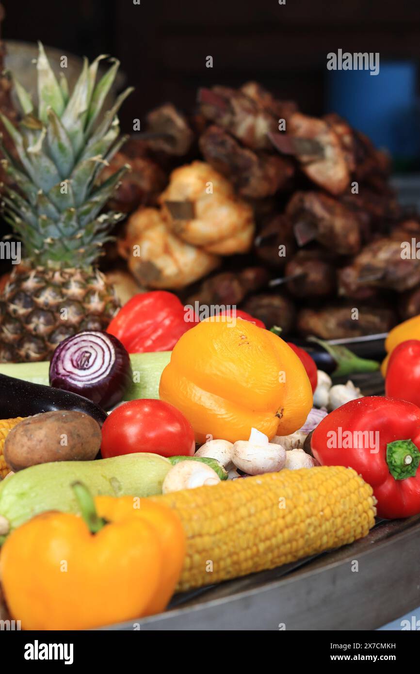 Street food at the fair, food court decorated with vegetables ...