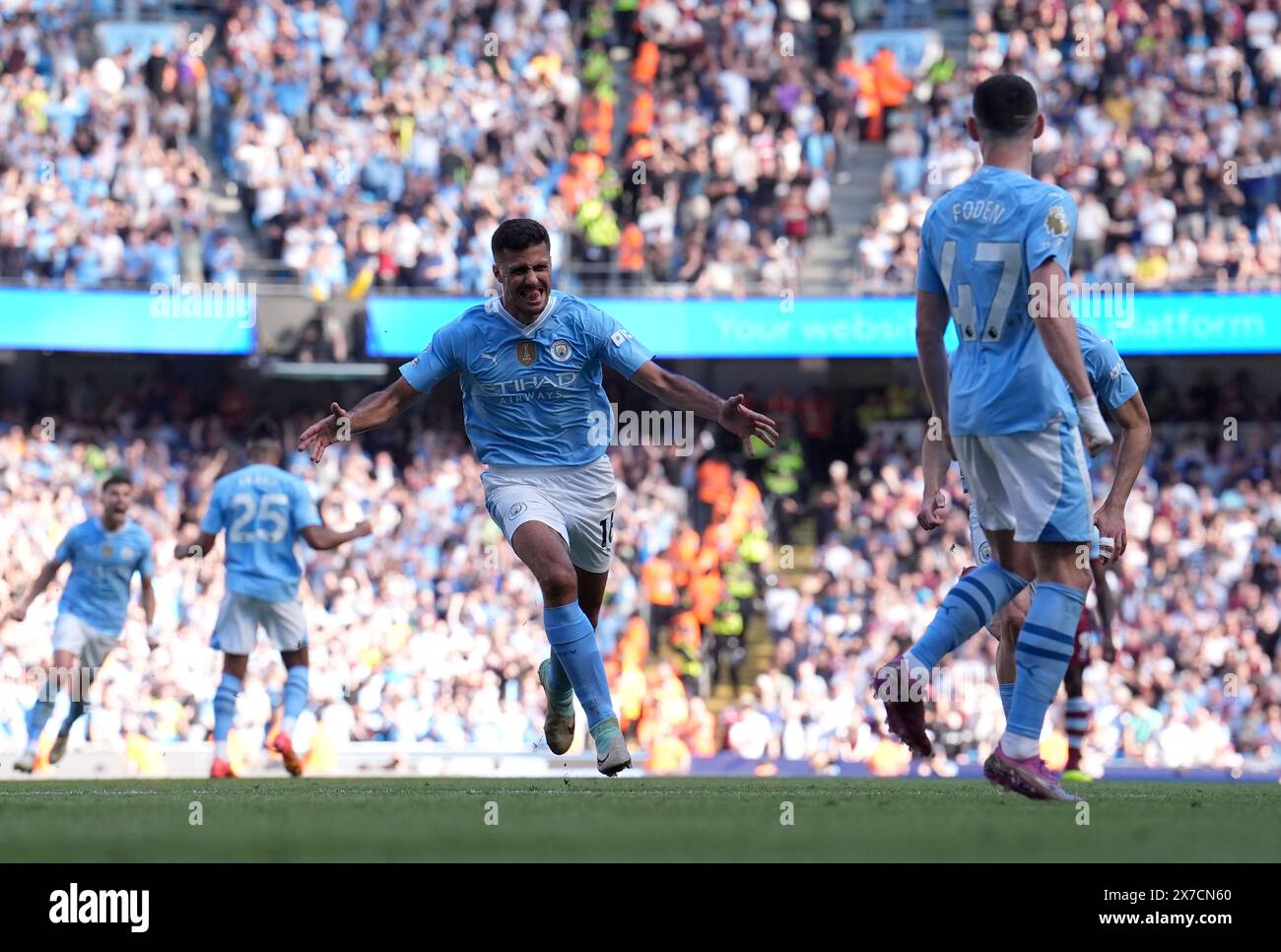 Manchester City's Rodri (centre) celebrates scoring their side's third ...