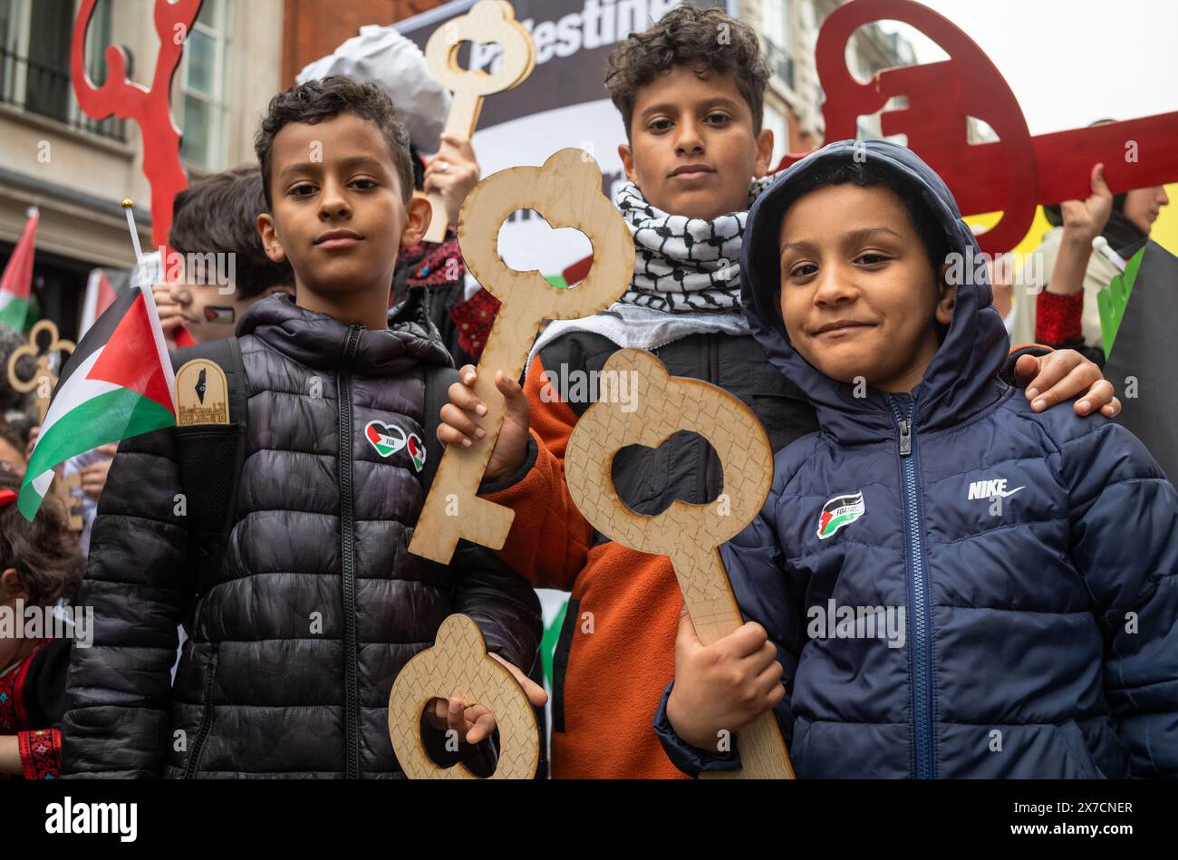 London, UK. 18 May 2024: Three young boys hold "Palestinian keys" at ...