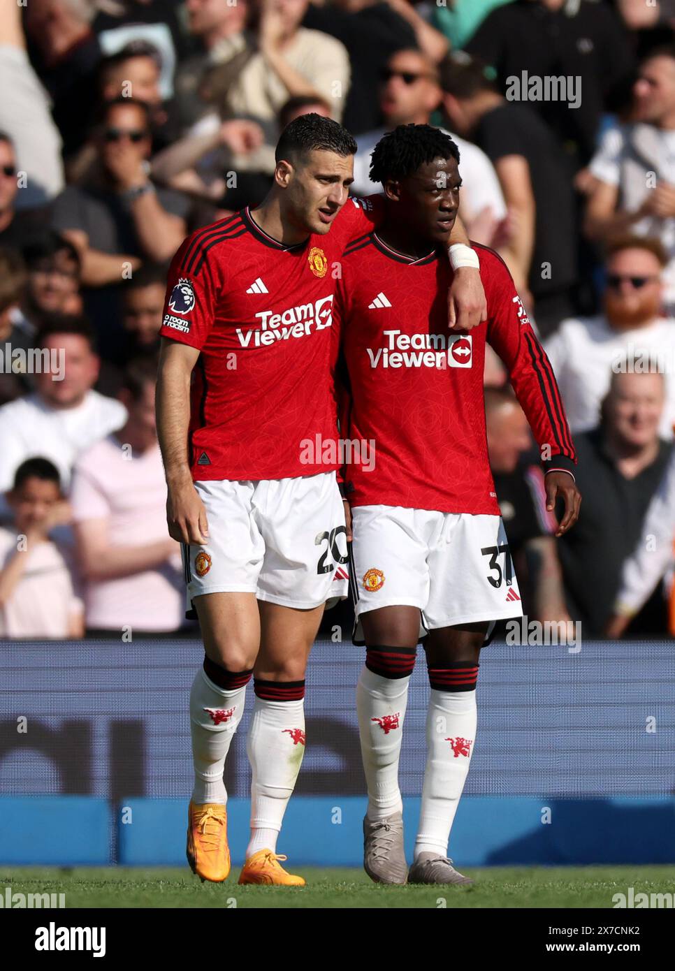 Manchester United's Diogo Dalot (left) celebrates with Kobbie Mainoo ...