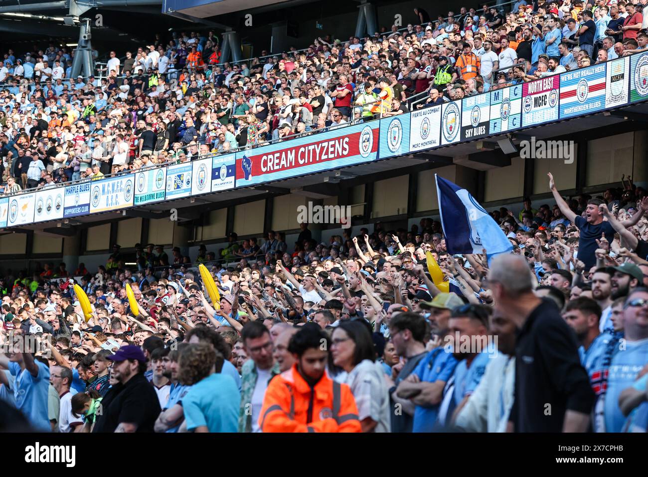 Man City supporters cheer on their team during the Premier League match ...