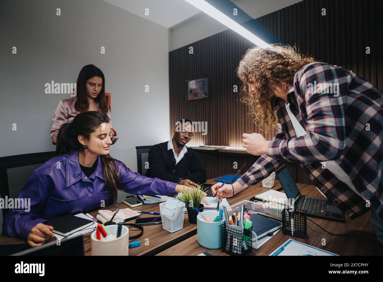 Dynamic teamwork in a modern office: Colleagues collaborating on a ...