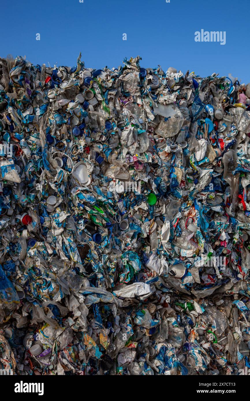 A large stack of empty and crushed beverage containers ready for ...