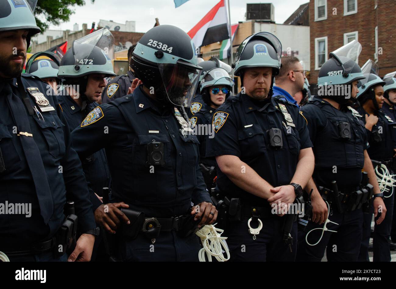 Brooklyn, USA. 18th May, 2024. NYPD officers form a line in front of a ...