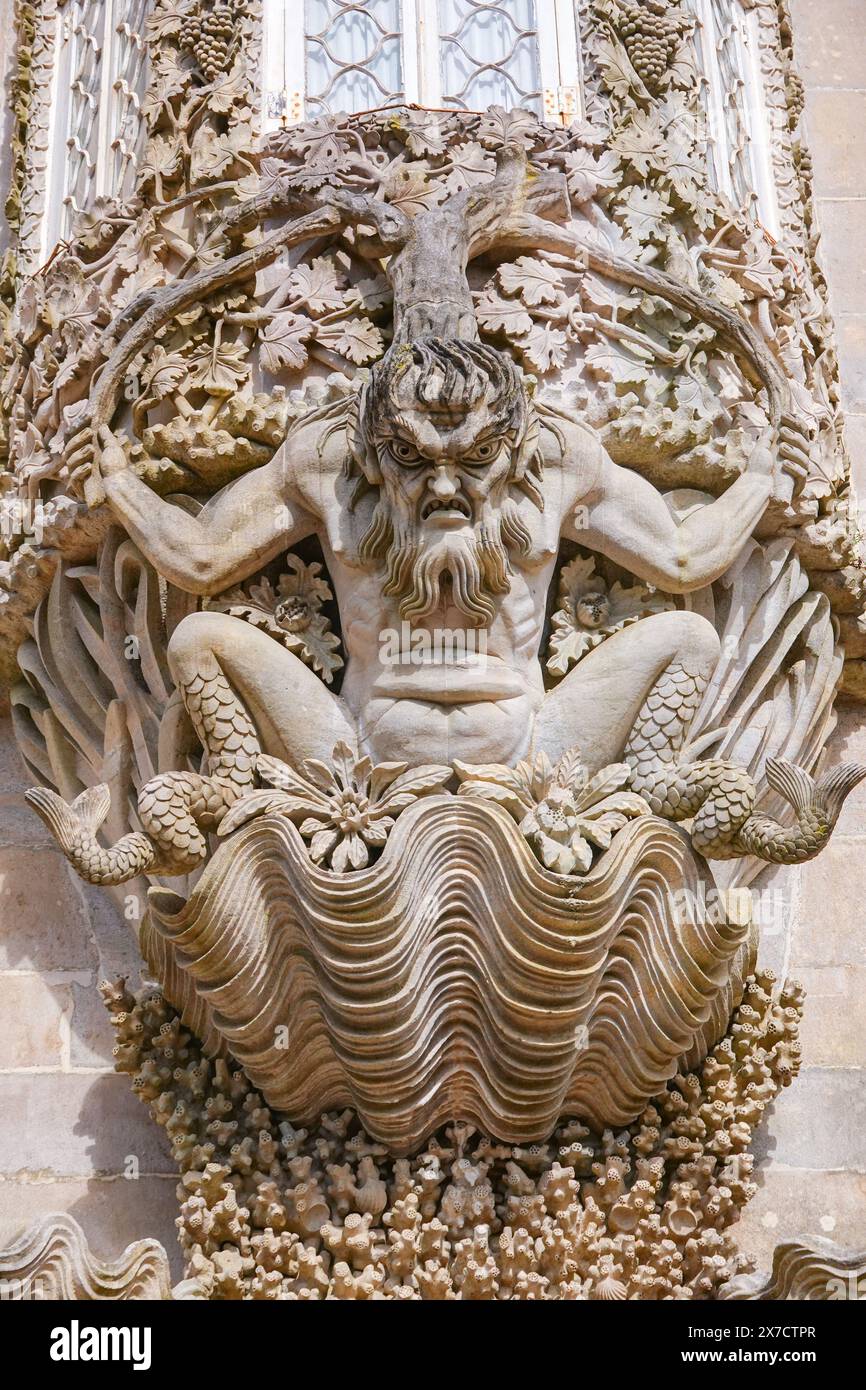 The ornate carved stone Triton Portico on the main facade at the Pena ...