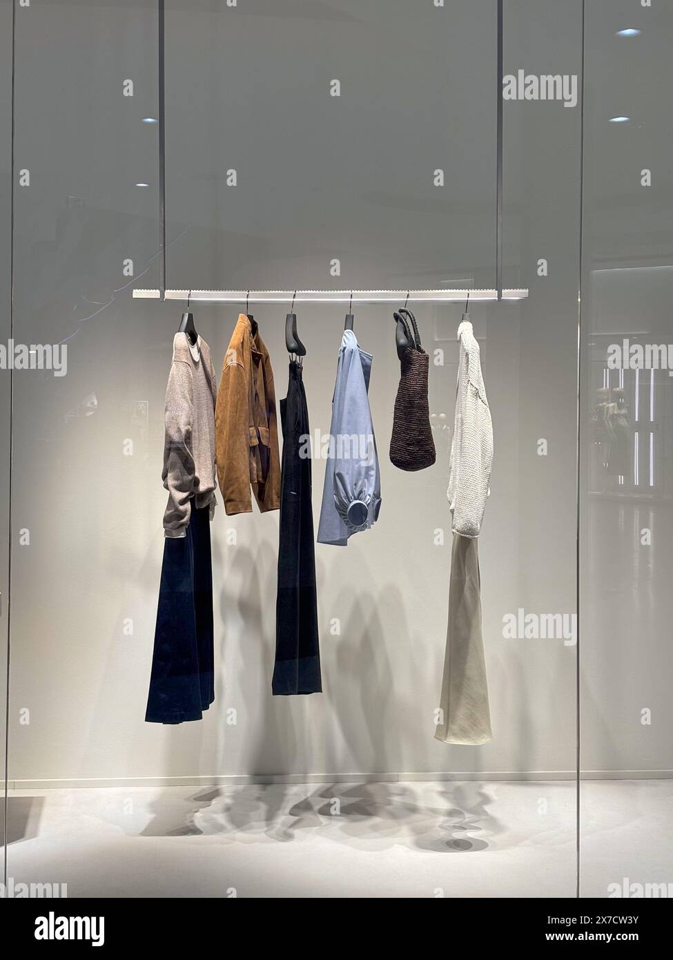 Stylish shop window with designer fashion clothes Stock Photo - Alamy