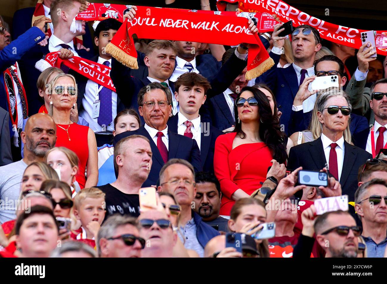 Liverpool owner John Henry (centre row, right), his wife Linda Pizzuti ...