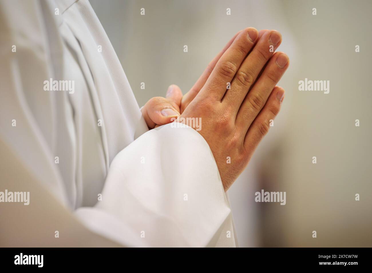 Hands holding eucharist in church hi-res stock photography and images ...