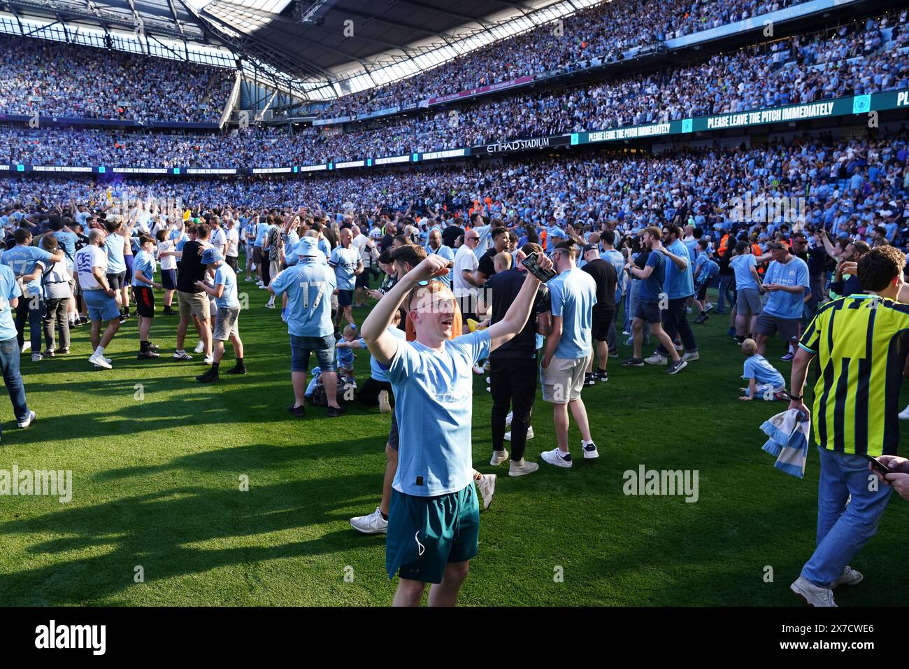 Manchester City fans invade the pitch following Premier League match at ...