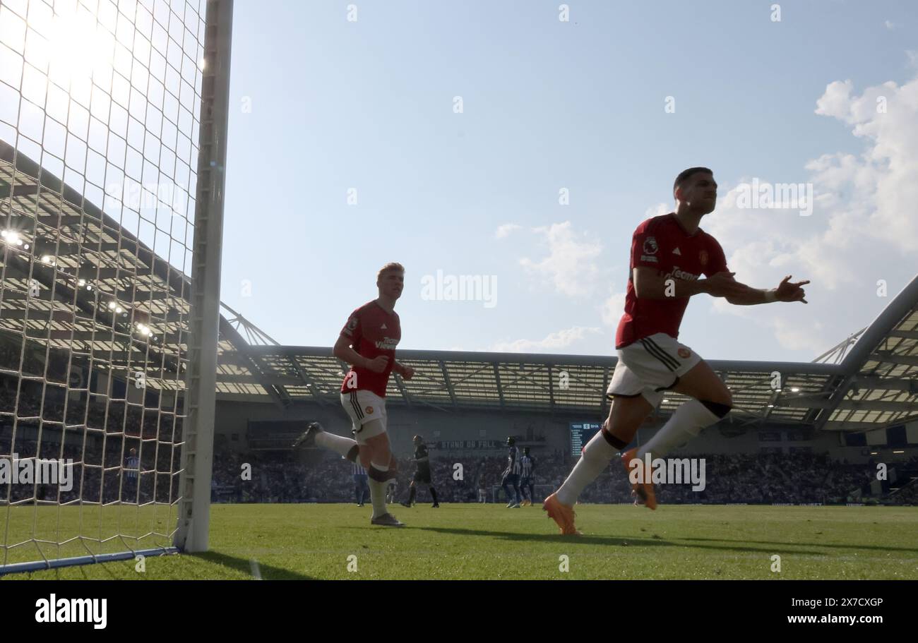 Manchester United's Diogo Dalot (right) celebrates after scoring his ...