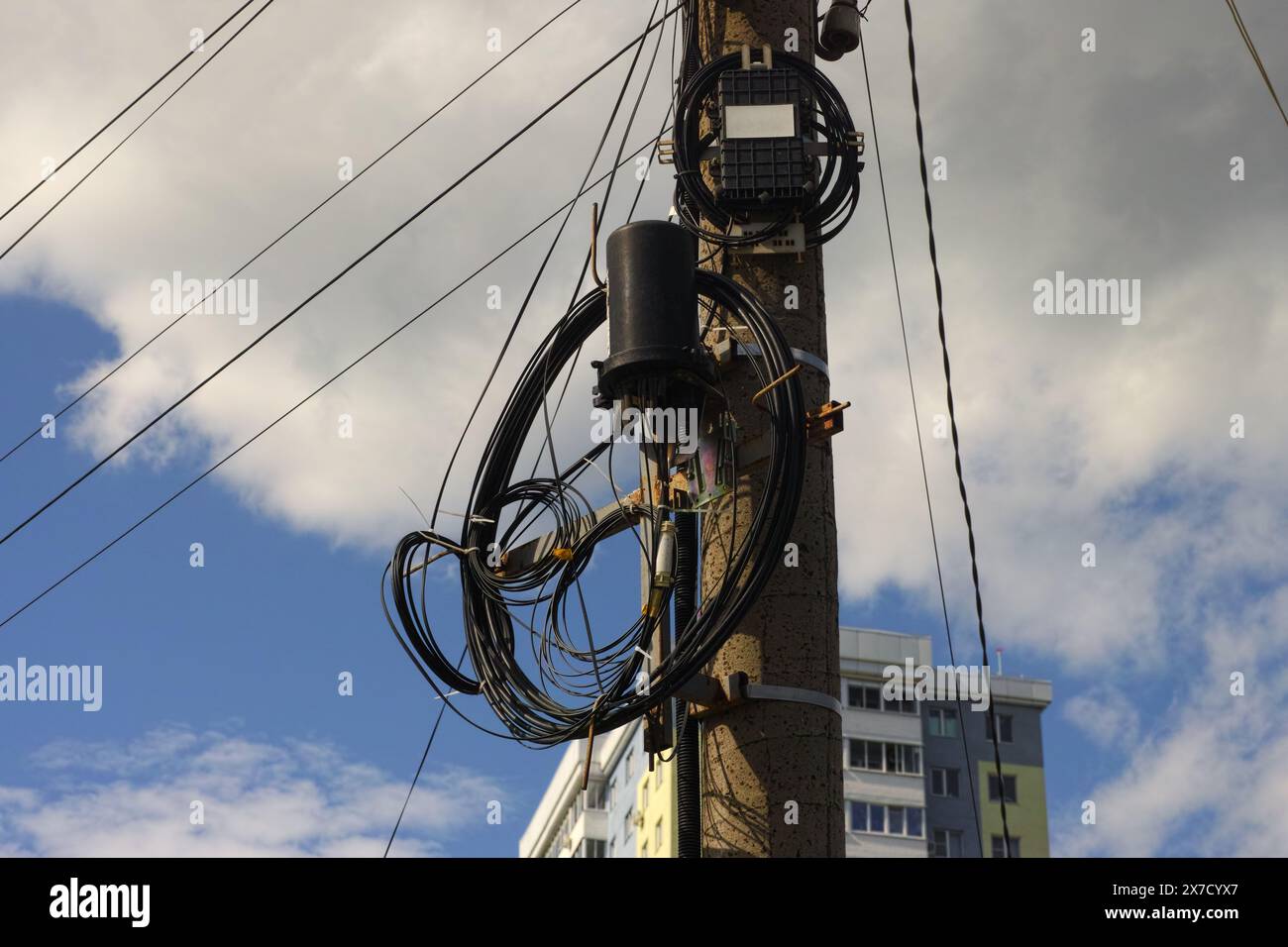 Optical cables hanging on a power pole Stock Photo - Alamy