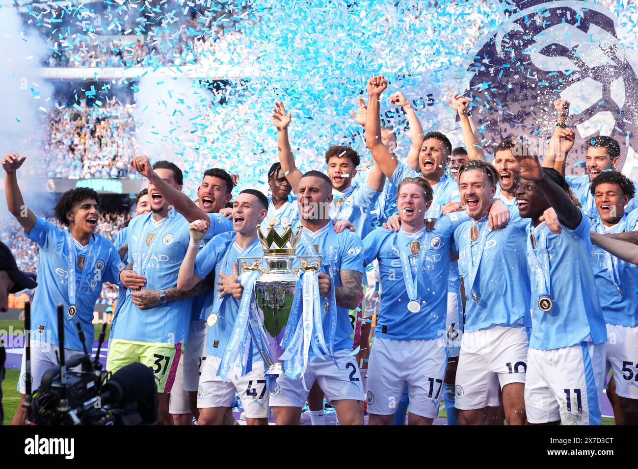Manchester City's Kyle Walker lifts the Premier League trophy with team ...