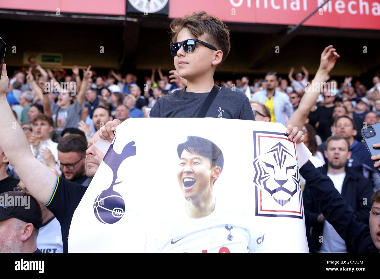A young fan holds up a sign for Tottenham Hotspur's Son Heung-Min after ...