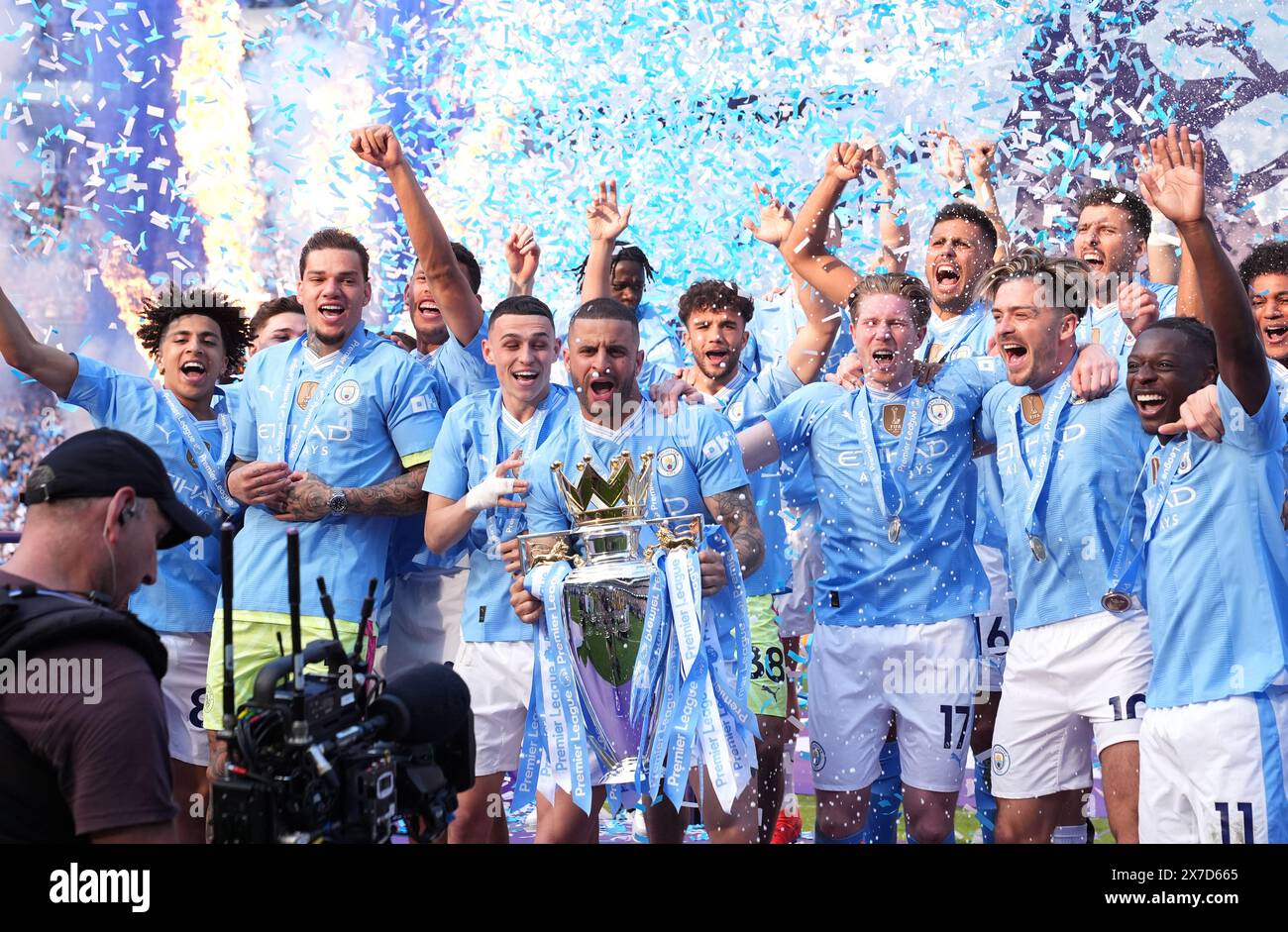 Manchester City's Kyle Walker lifts the Premier League trophy with team ...