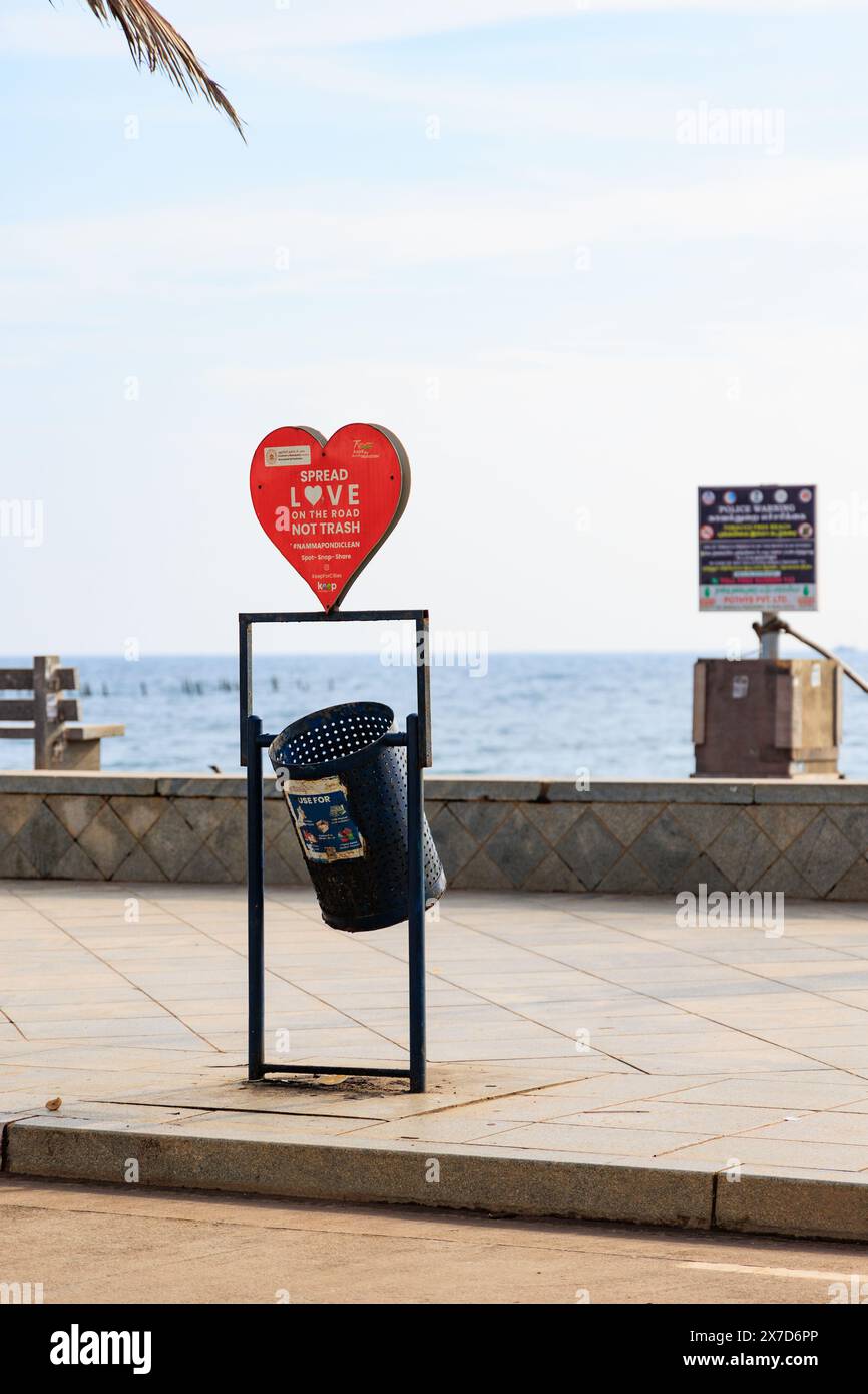 Dustbin with a message to 'Spread Love Not Trash' on the promenade in ...