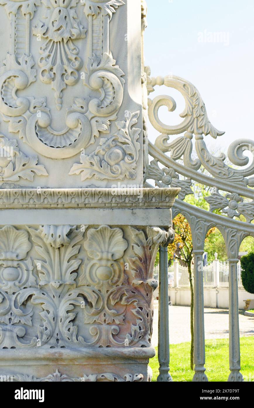 A close-up fragment of the Kucuksu Palace fence: a marble pillar ...