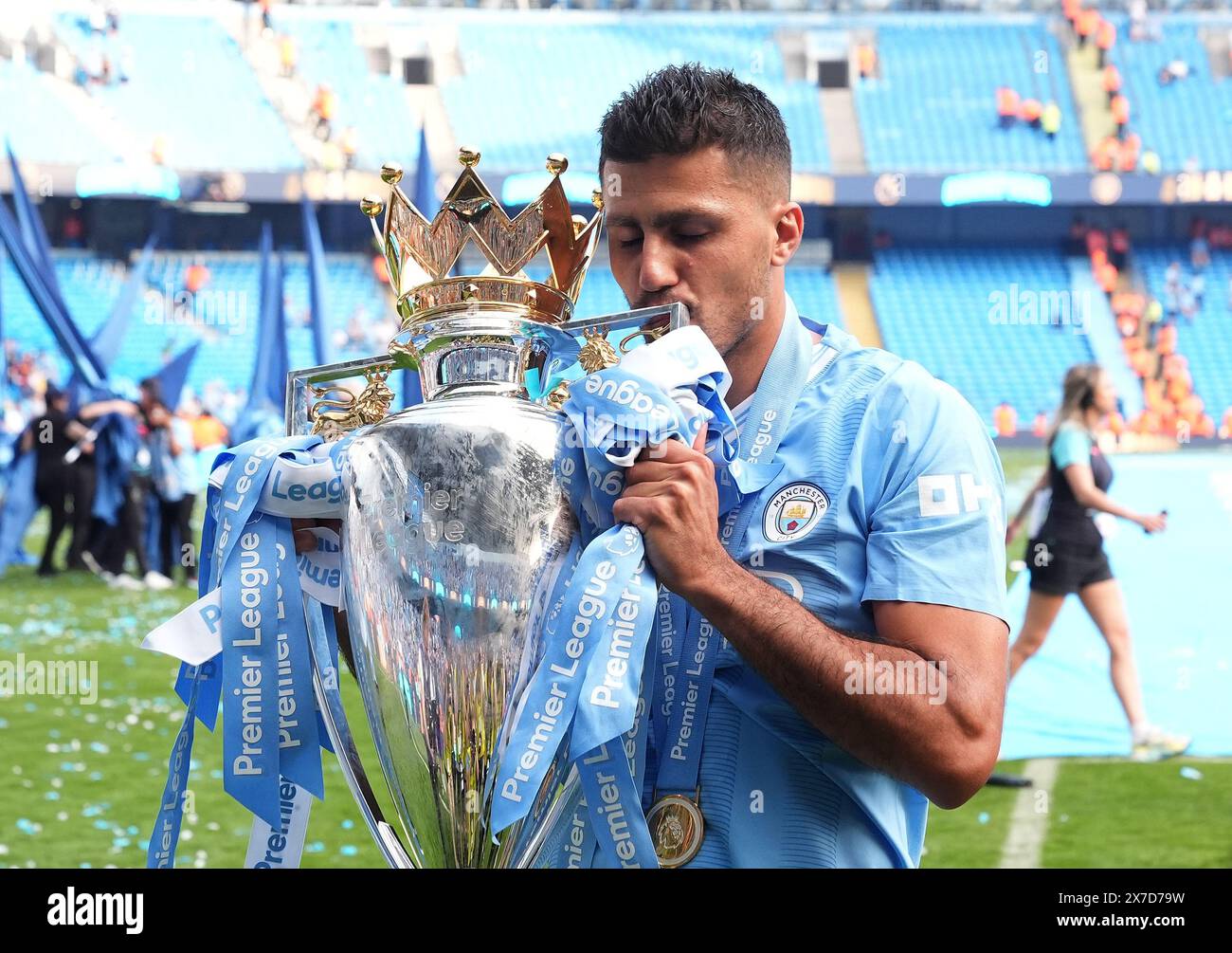 Manchester City's Rodri celebrates with the Premier League trophy with ...