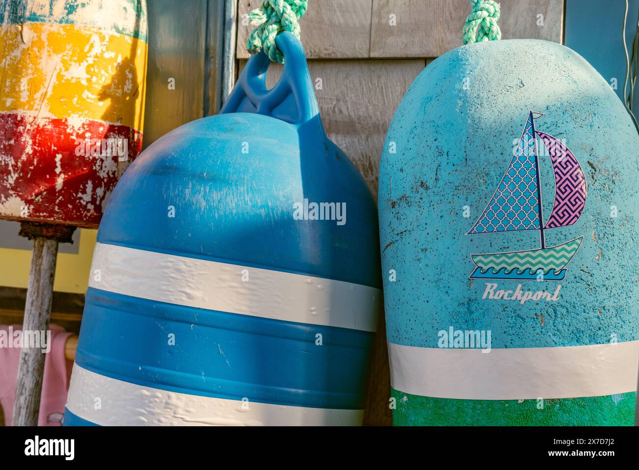 Colorful decorative buoys on the main street in the historic fishing ...