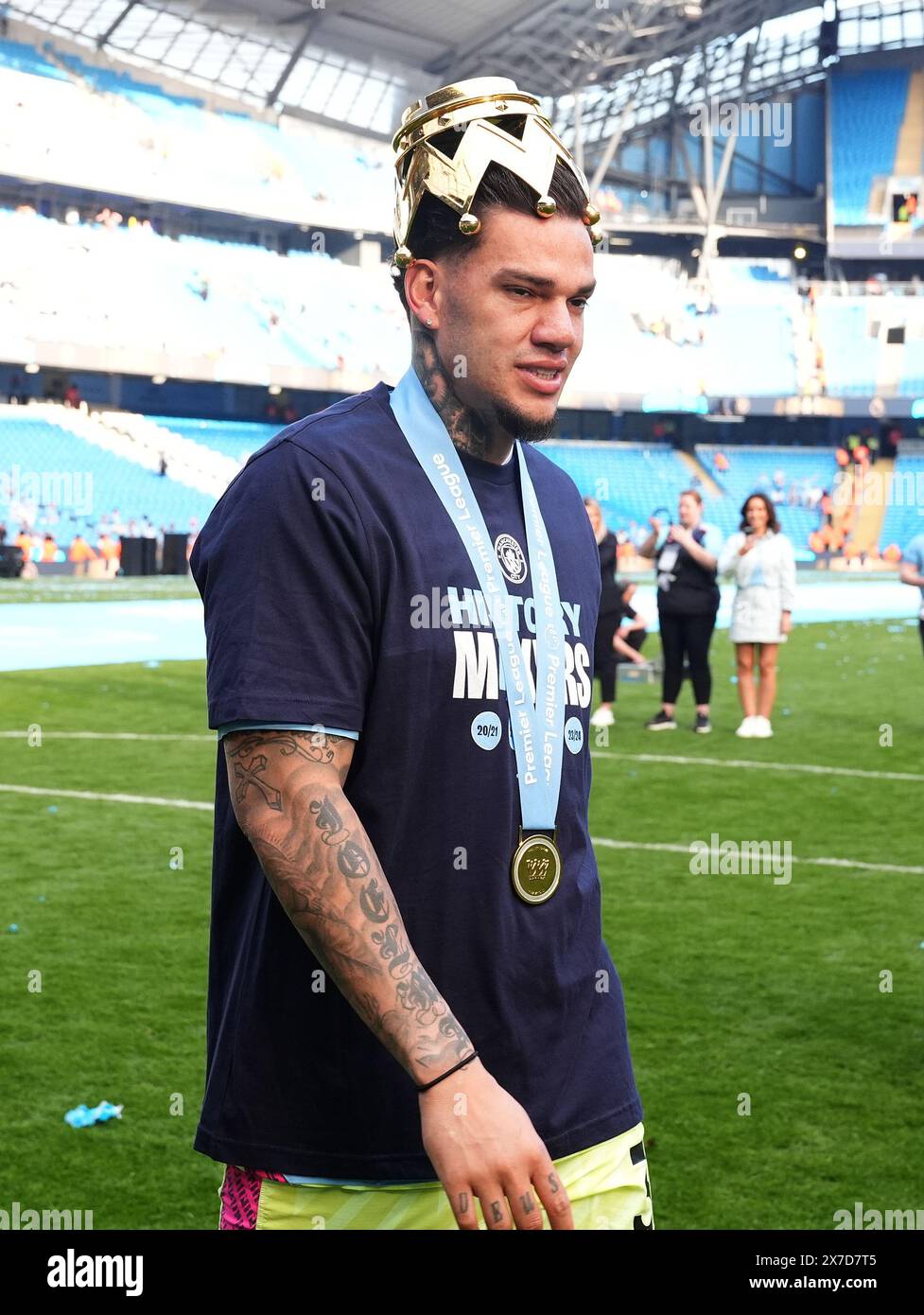 Manchester City goalkeeper Ederson celebrates with the crown off the ...