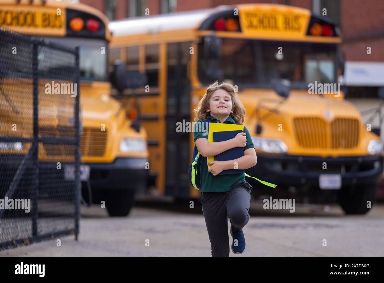 Educational concept. Pupil getting on the school bus. American School ...