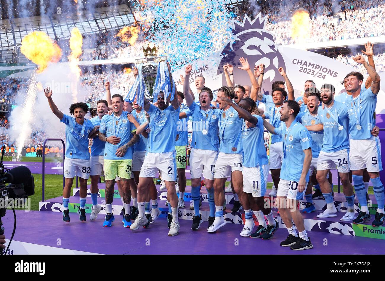 Manchester City's Kyle Walker lifts the Premier League trophy with team ...