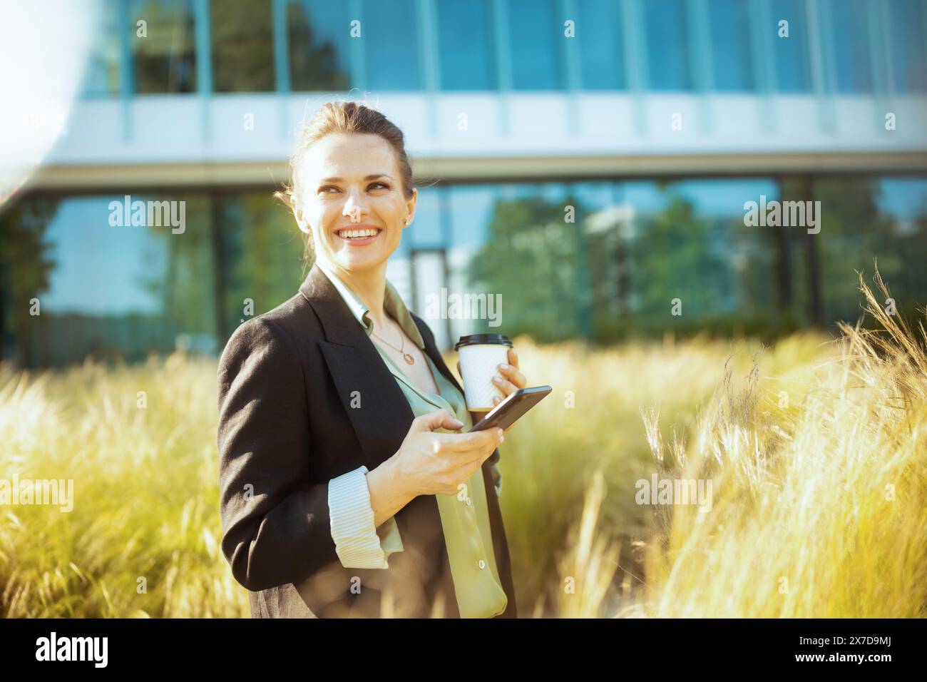 smiling modern 40 years old woman employee near business center in ...