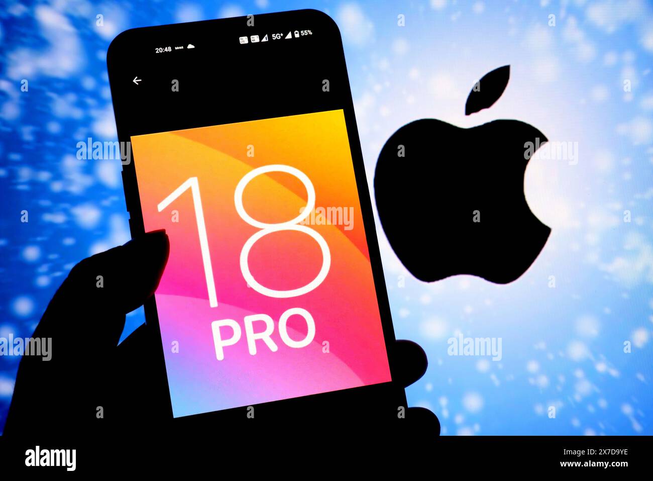 In this photo illustration, a 18Pro Apple OS logo seen displayed on a smartphone with an Apple ...