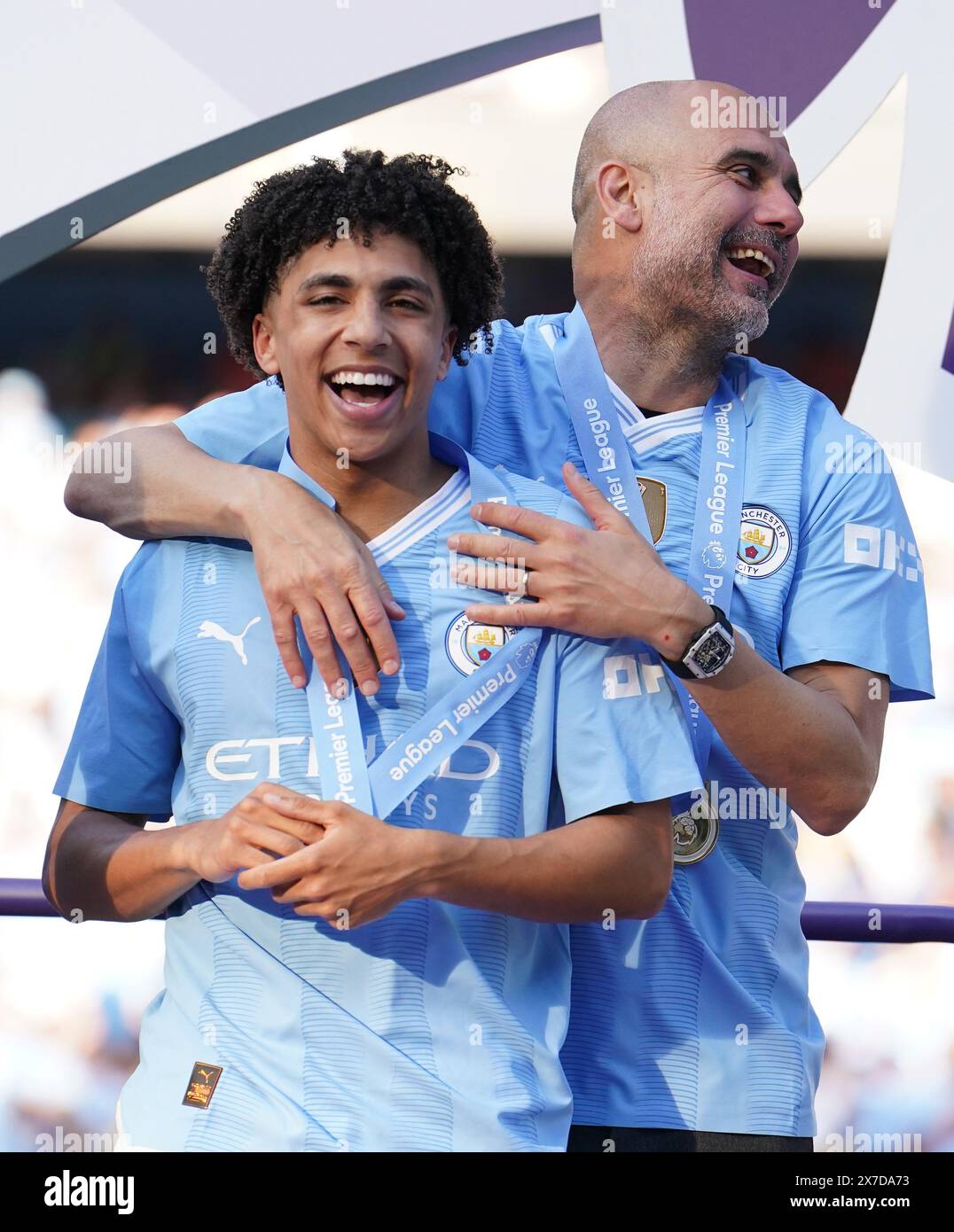 Manchester City manager Pep Guardiola celebrating with Rico Lewis after ...