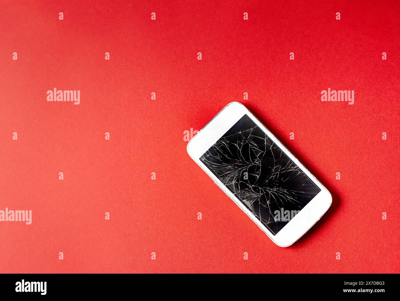 Broken mobile phone with cracked display on Broken mobile phone with ...