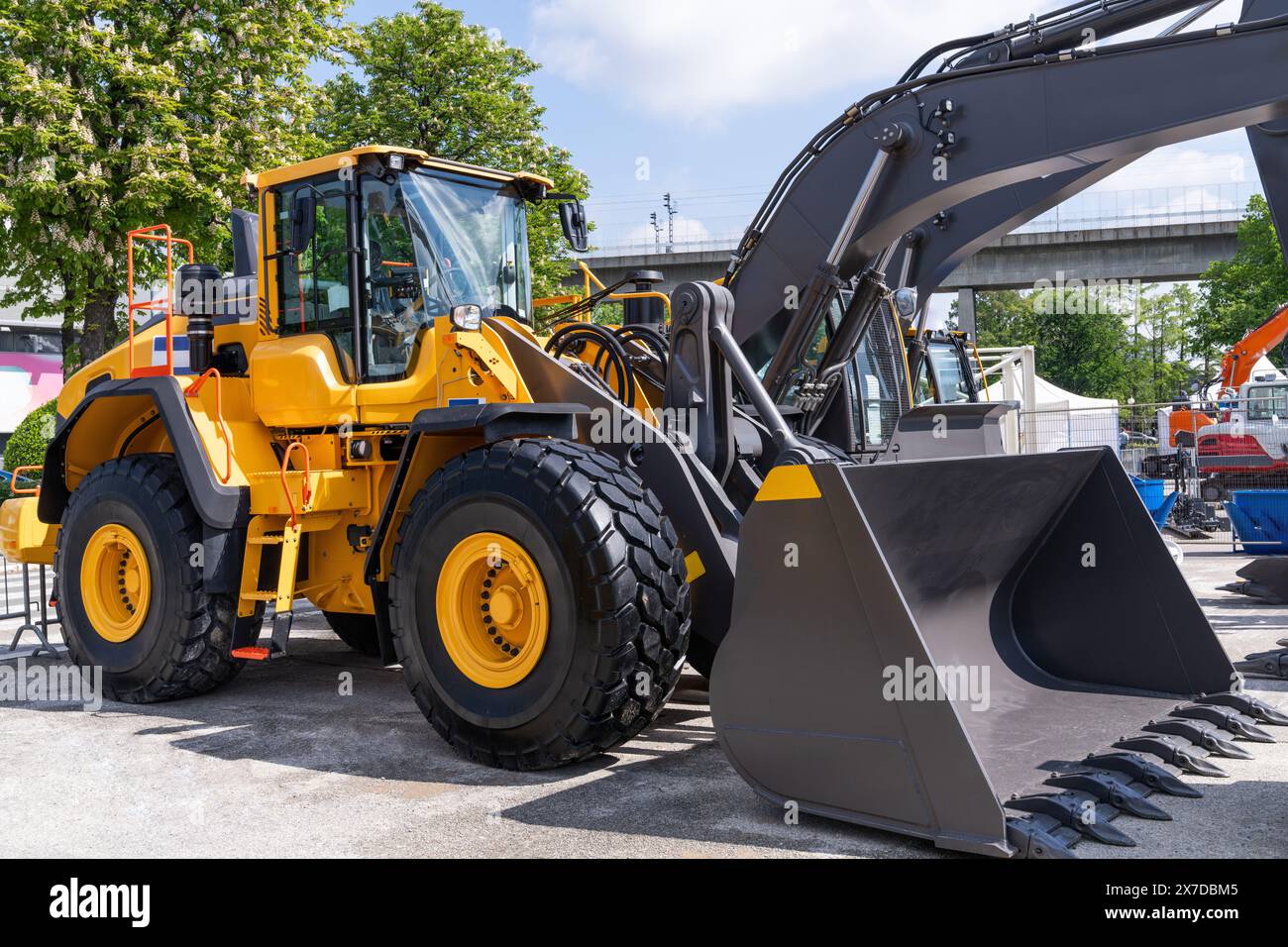 Fleet of yellow construction machines Stock Photo - Alamy
